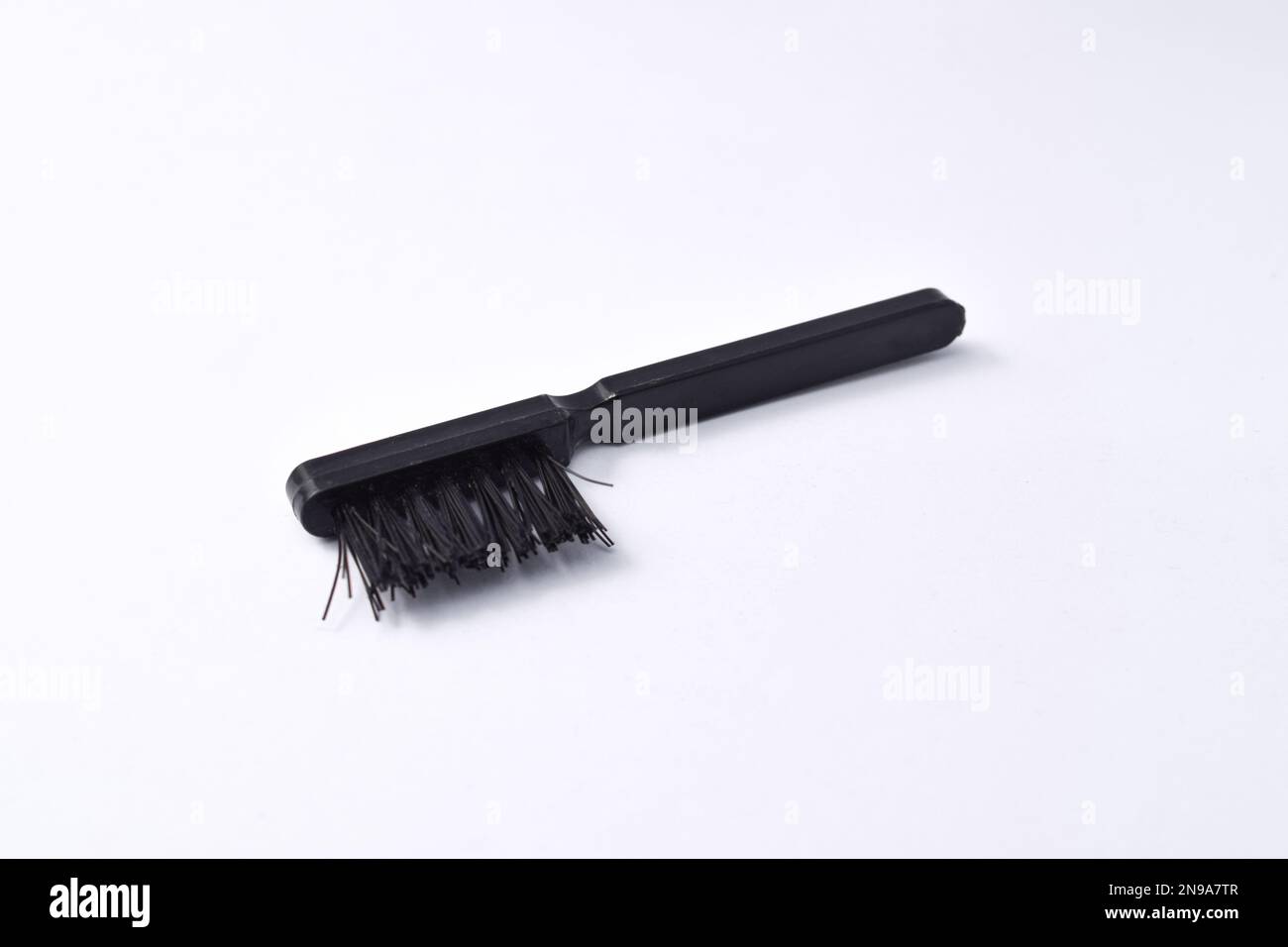 Small cleaning brush isolated on white background. To clean between the ...