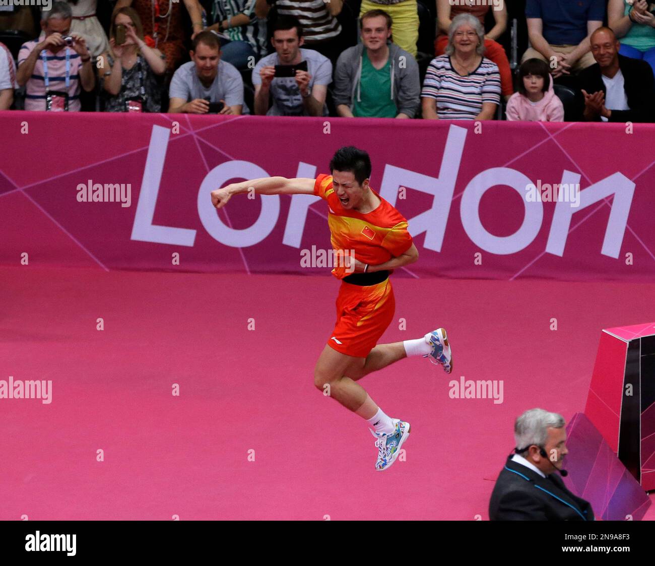 China's Cai Yun jumps into the air in celebration aftew he and his ...