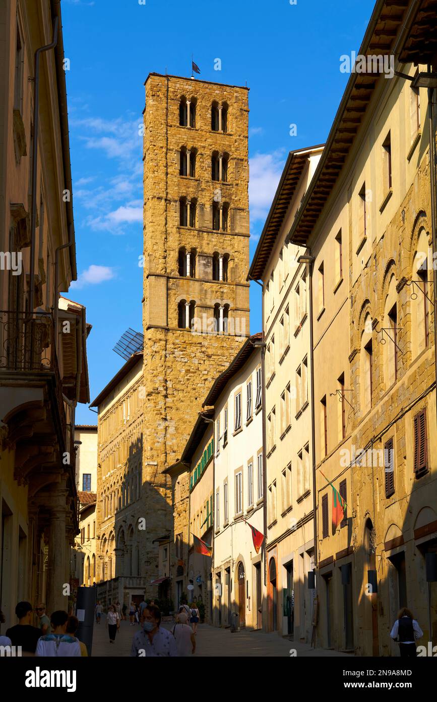 Arezzo, Tuscany, Italy. A group of people walking down a street next to ...