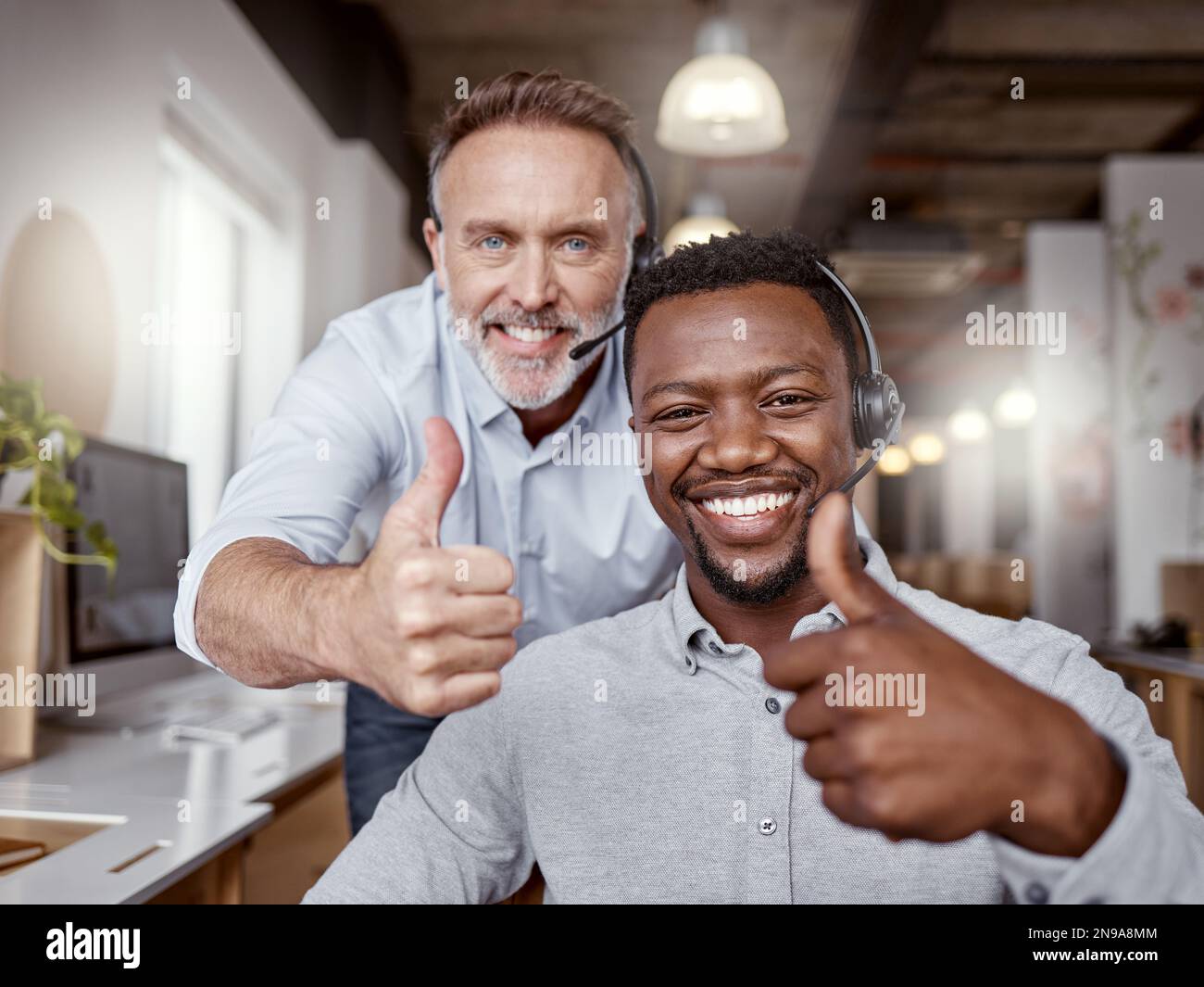 Thumbs up african man headset hi-res stock photography and images - Alamy