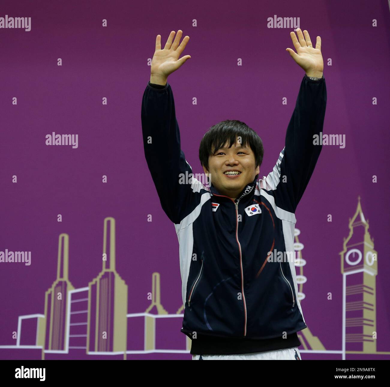 South Korea's Choi Young-rae reacts as he mounts the medals podium to ...