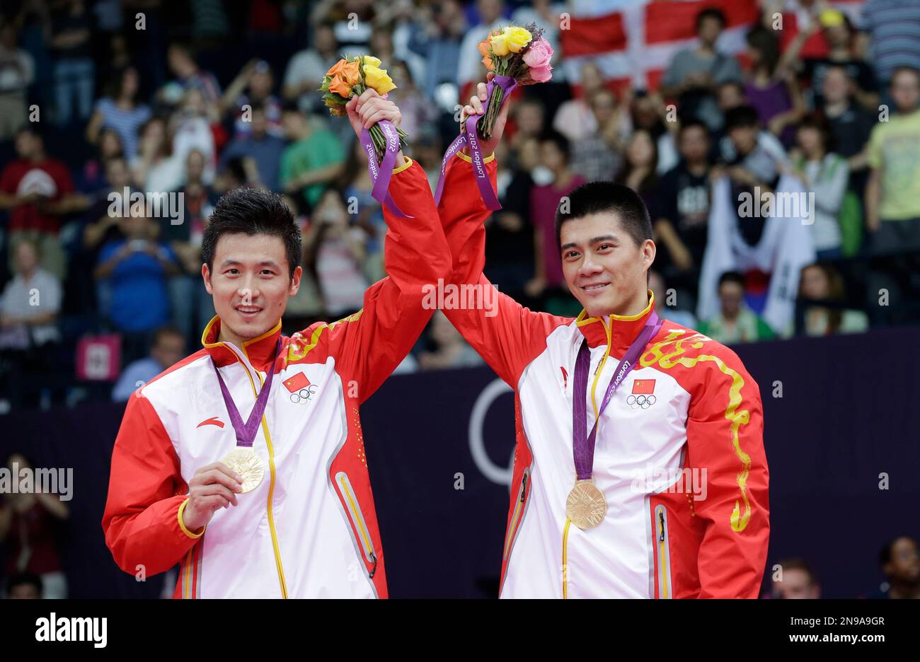 China's Cai Yun, left, and Fu Haifeng pose with their gold medals for ...