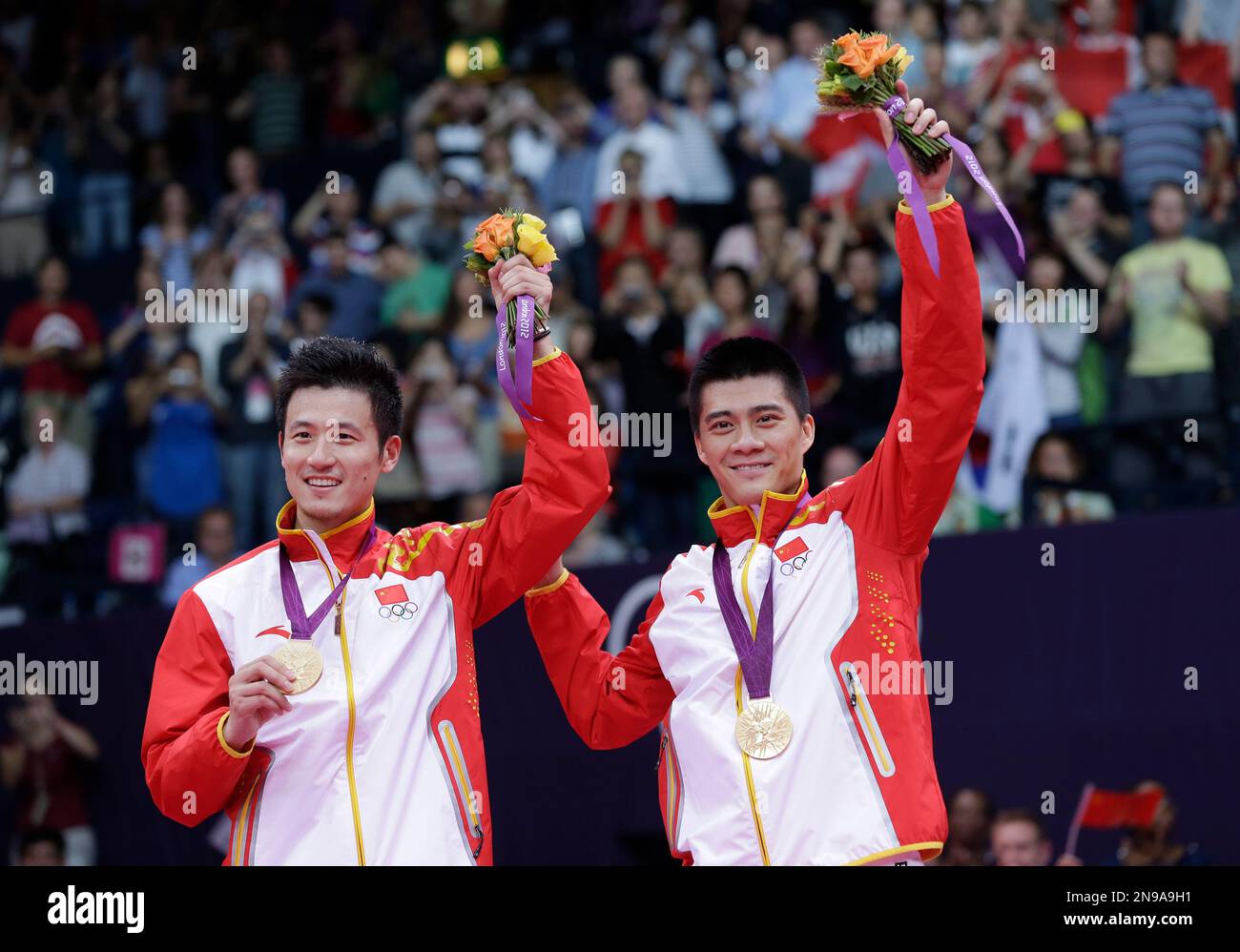 China's Cai Yun, left, and Fu Haifeng pose with their gold medals for ...