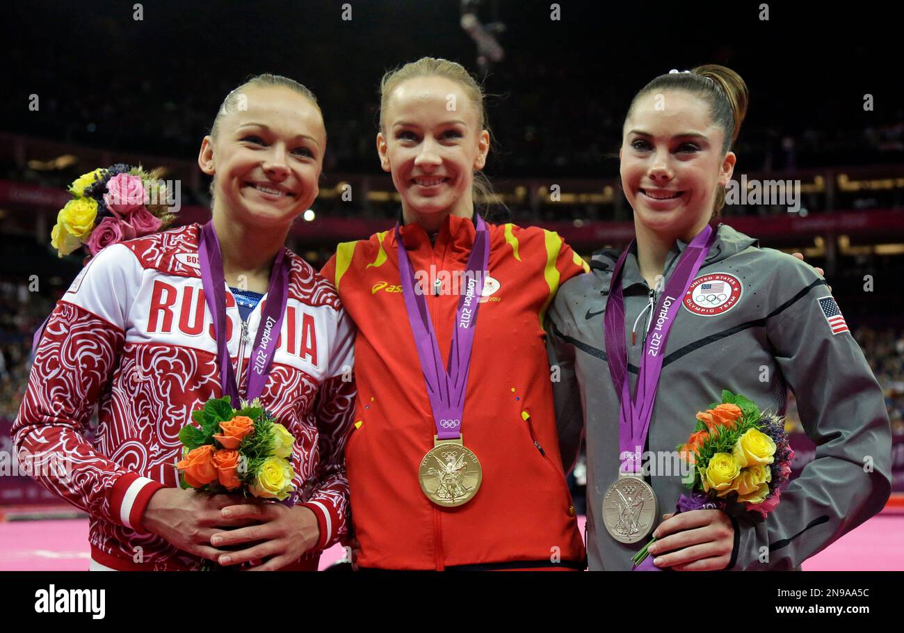 Russian bronze medallist gymnast Maria Paseka, left, Romania's gold ...