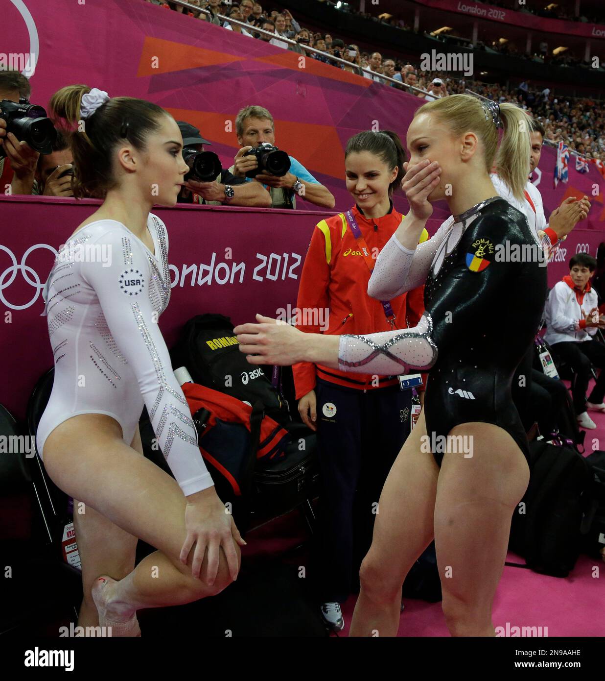 Gold medallist Romania's gymnast Sandra Raluca Izbasa, right, walks ...