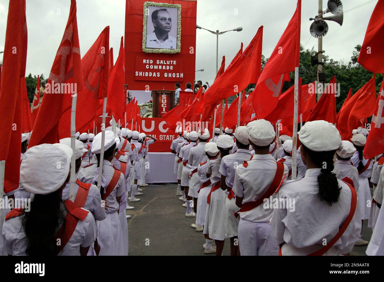 Members of KOMSOMOL, the youth wing of the Socialist Unity Centre of India (Communist), pay ...