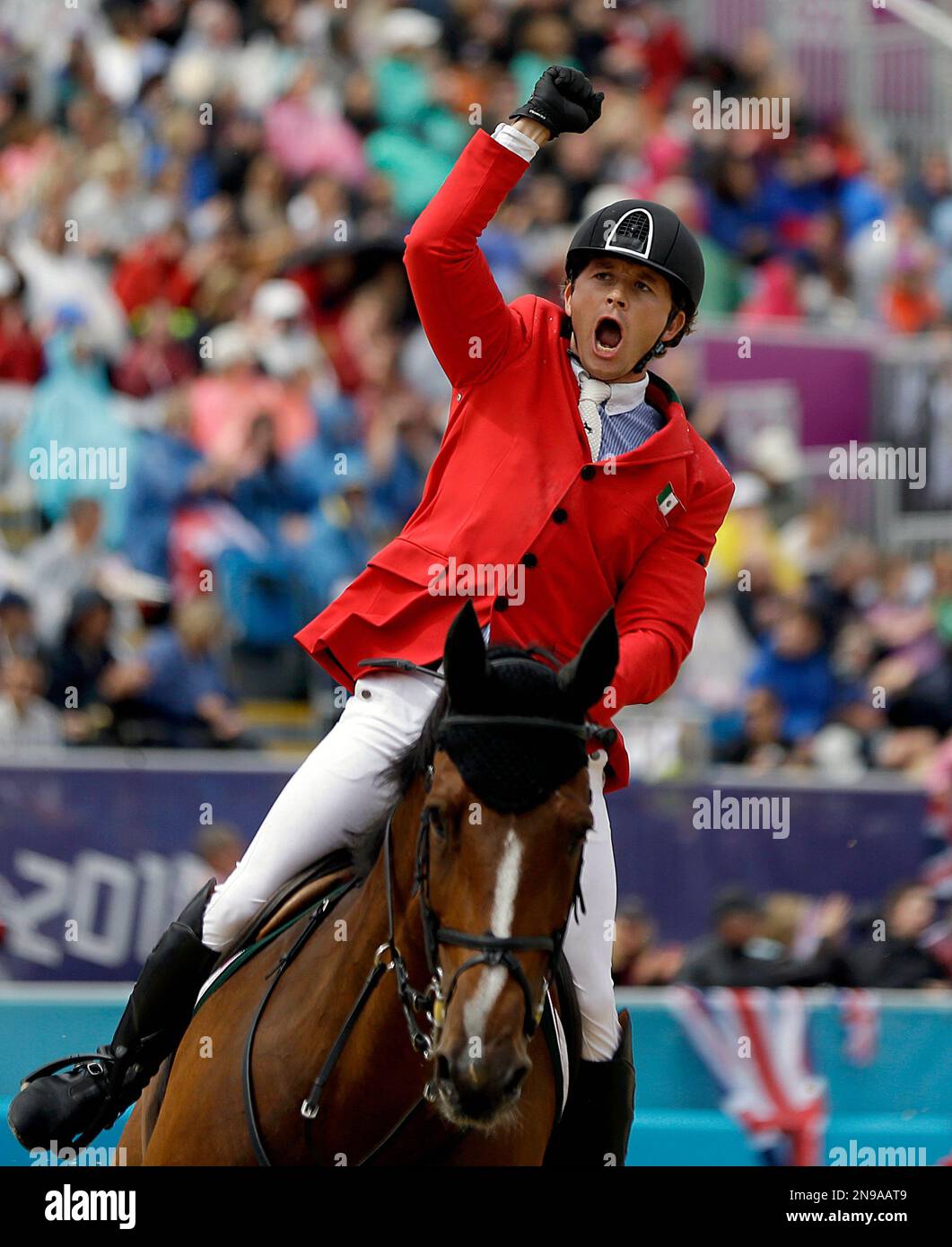 Alberto Michan, of Mexico, reacts after riding his horse Rosalia la ...