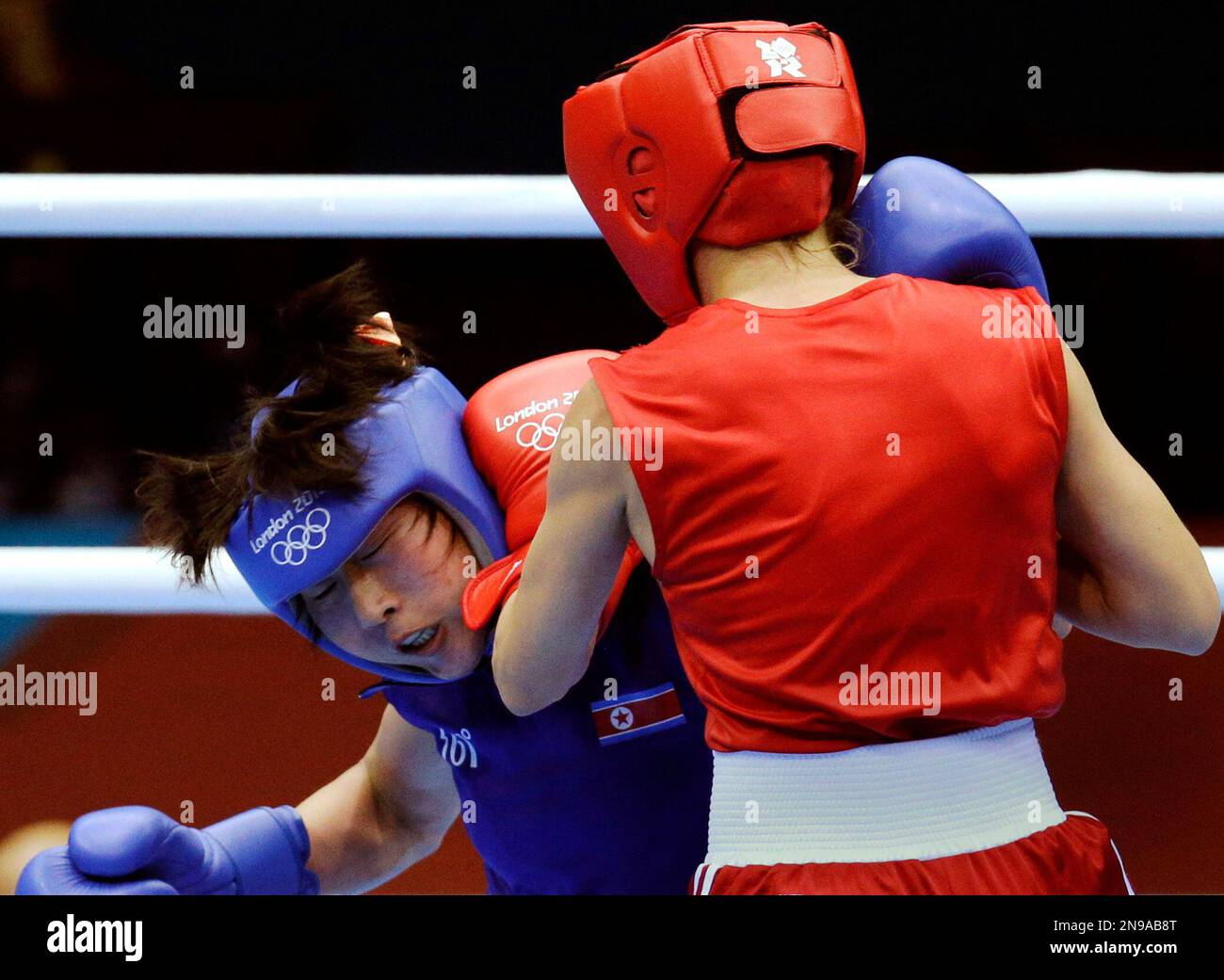 North Korea's Kim Hye Song, left, and Russia's Elena Savelyeva , fight ...