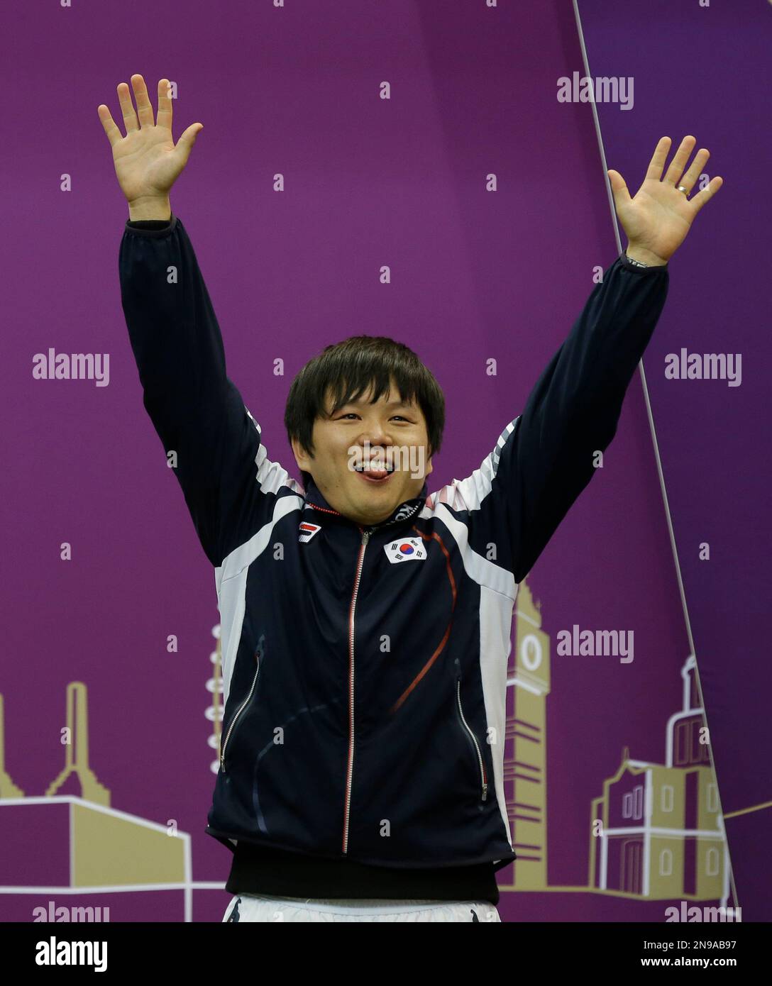 South Korea's Choi Young-rae reacts as he mounts the medals podium to ...