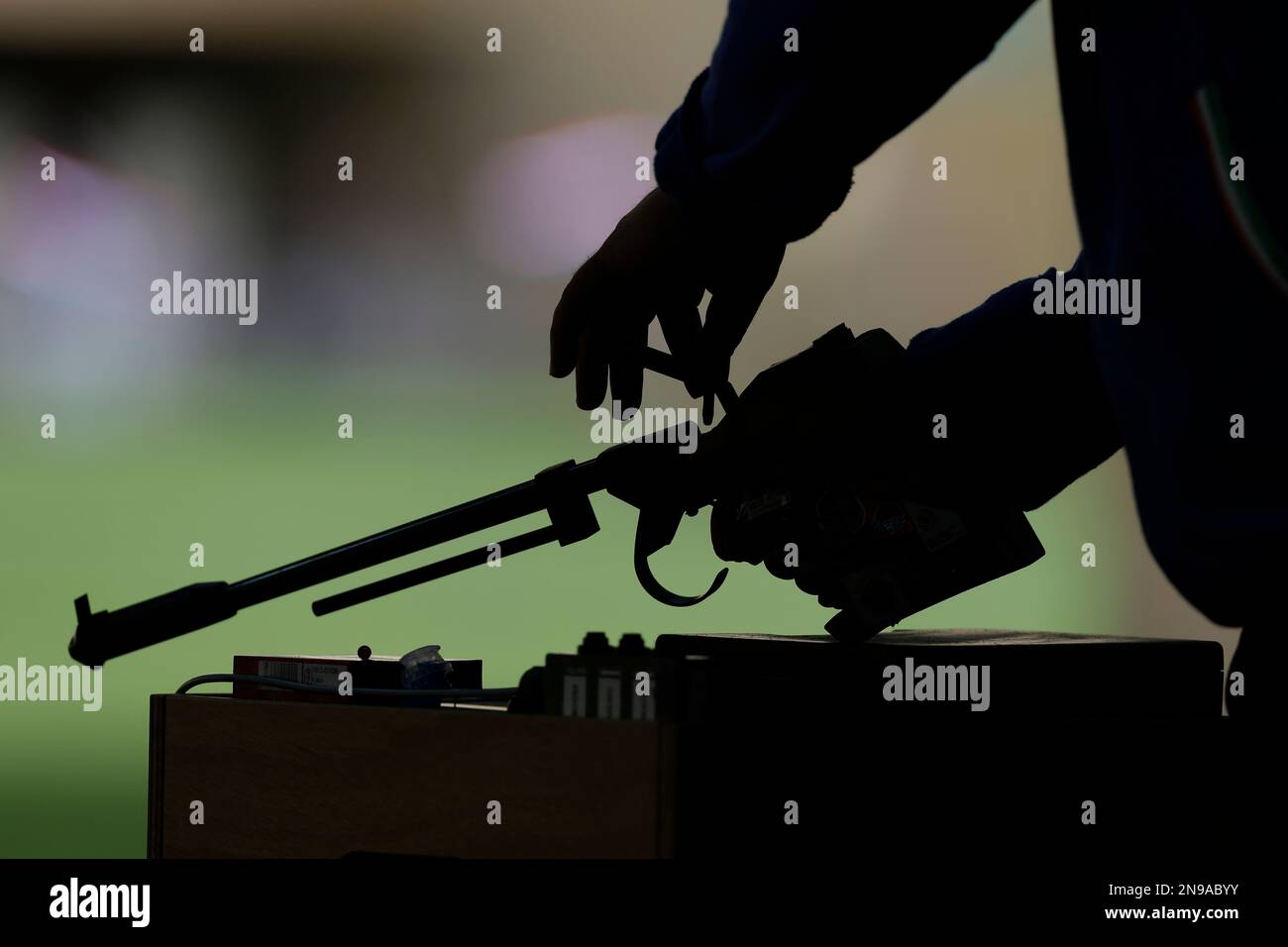 Iran's Ebrahim Barkhordari loads his gun during qualifiers for the men ...