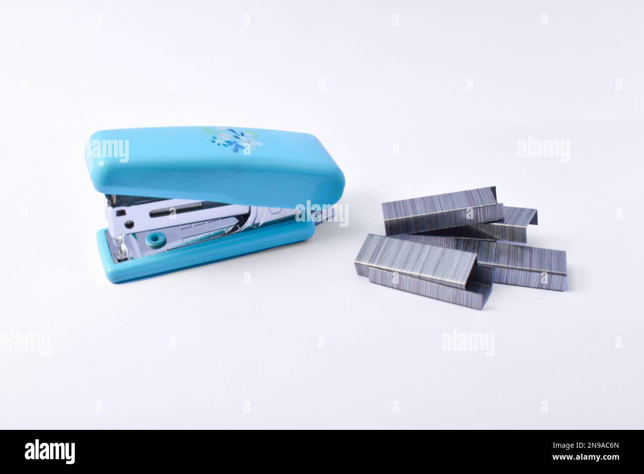 Office stationary Blue stapler and staples isolated on white background ...