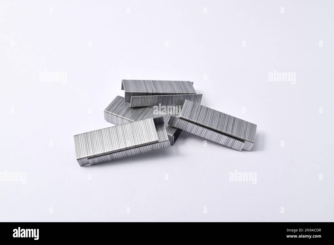 Pile of metal staples for stapler isolated on white background Stock ...