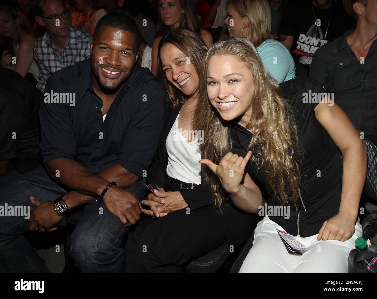 From left, Michael Strahan, AnnMaria De Mars and Ronda Rousey attend ...