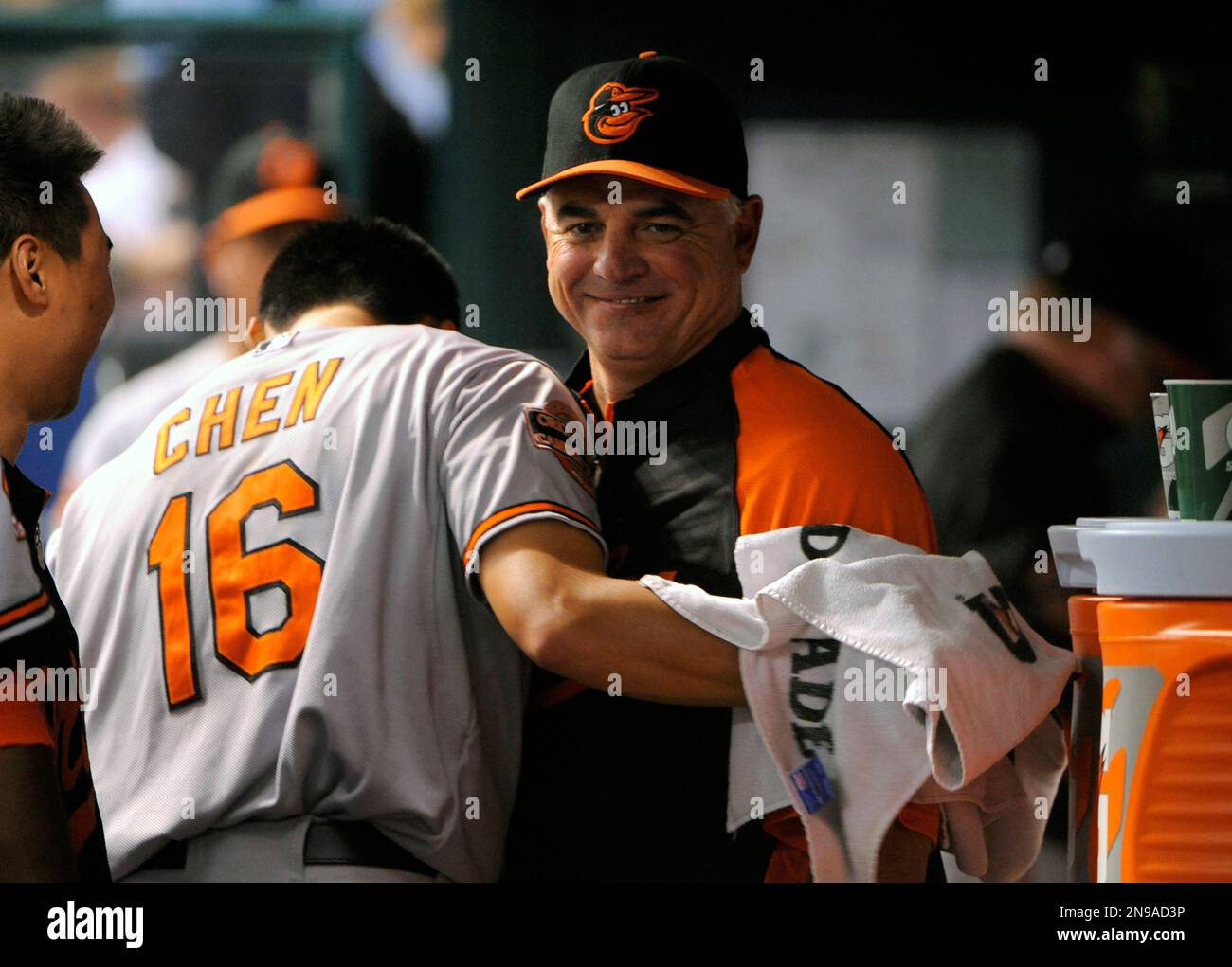 Baltimore Orioles starting pitcher Wei-Yin Chen (16), of Taiwan, hugs ...