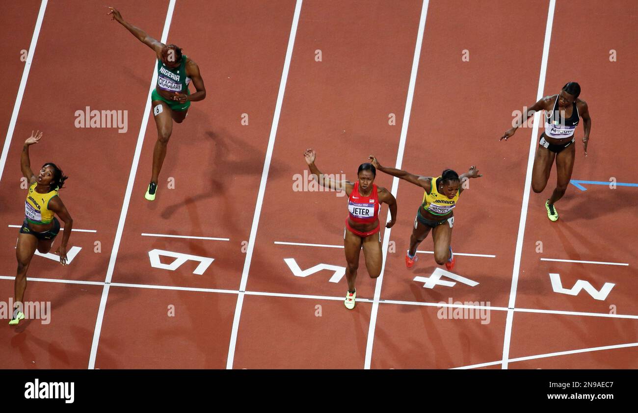 Jamaica's Shelly-Ann Fraser-Pryce, left, crosses the finish line to win gold ahead of United ...