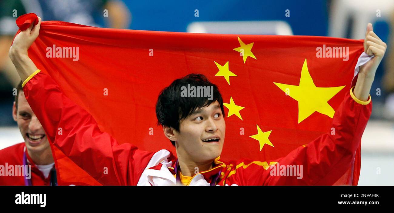 China's Sun Yang reacts on the podium after winning in the gold medal ...