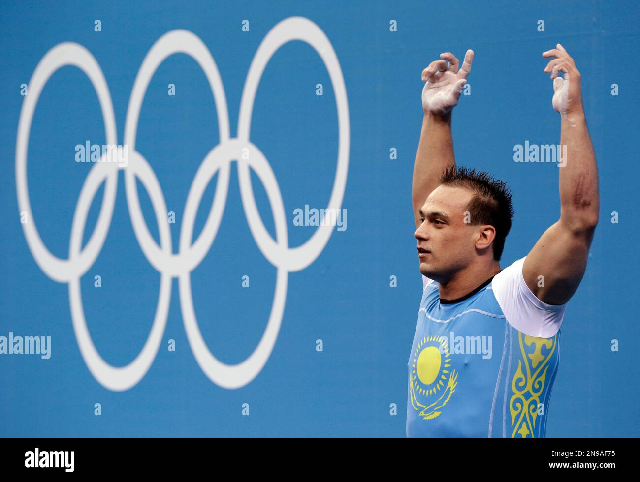 Kazakhstan's Ilya Ilyin reacts after a world record 233-kg clean-and ...