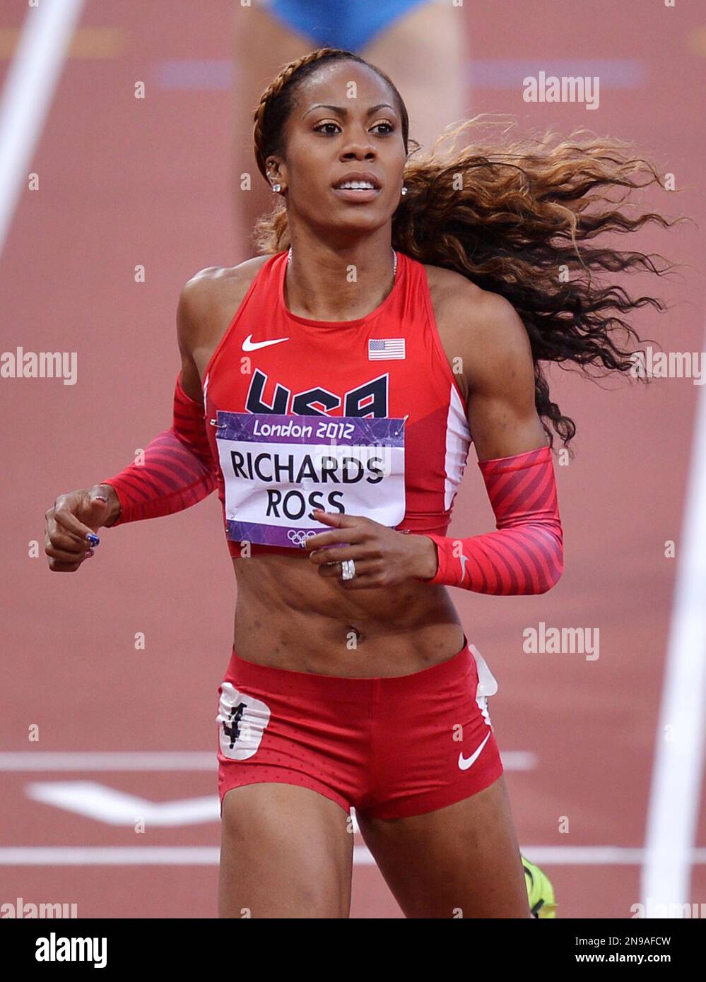 United States' Sanya Richards-Ross crosses the finish line in a women's ...