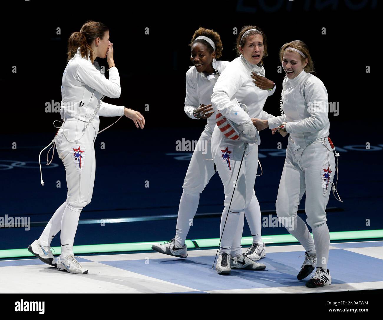 United States team members, from left, Kelley Hurley, Maya Lawrence ...