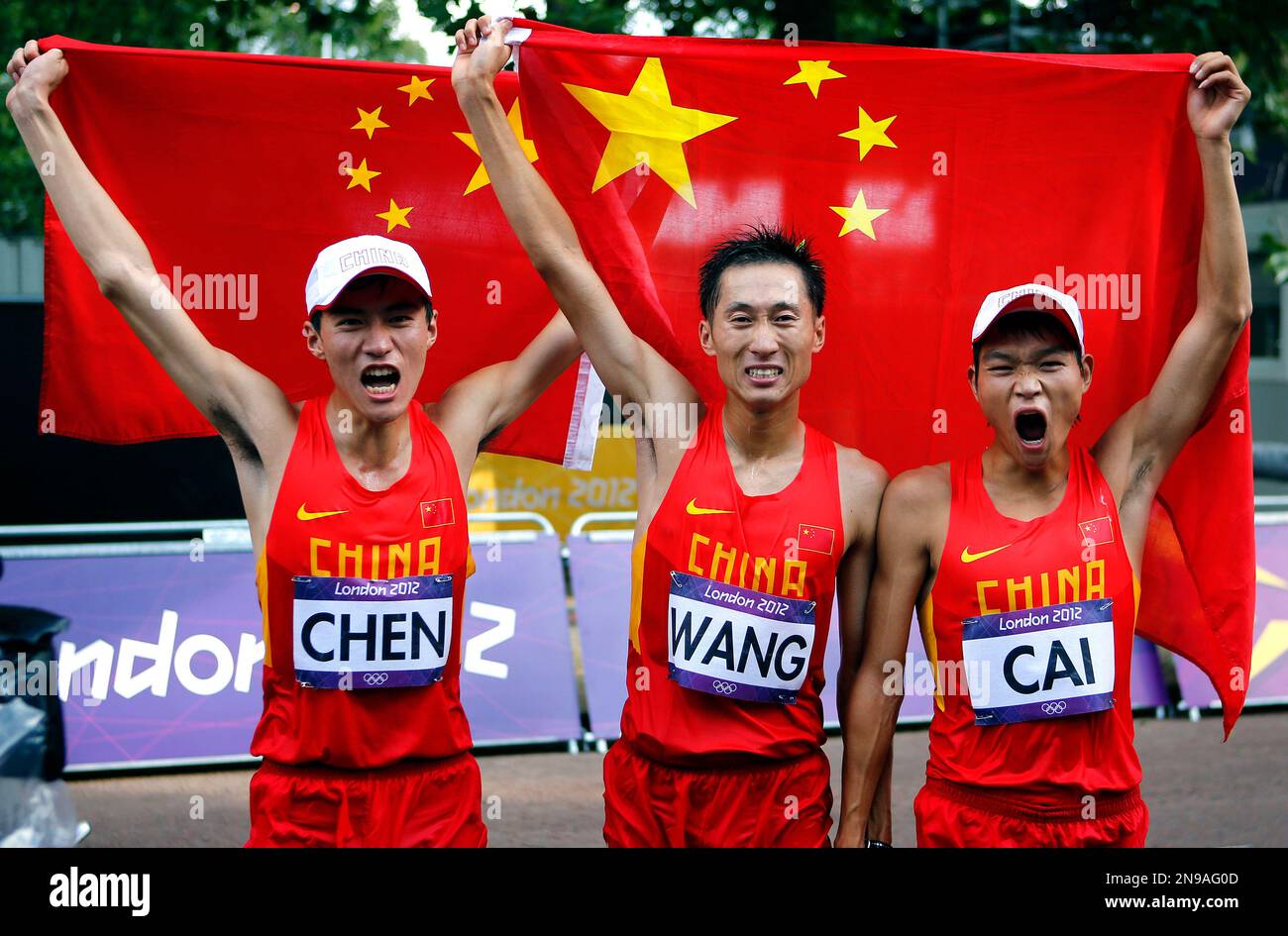 China's Chen Ding, Wang Zhen and Cai Zelin celebrate after finishing ...