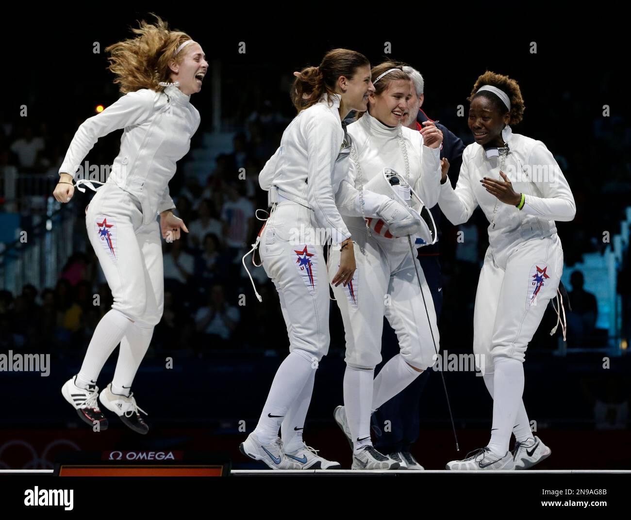 United States team members, from left, Susie Scanlan, Kelley Hurley ...