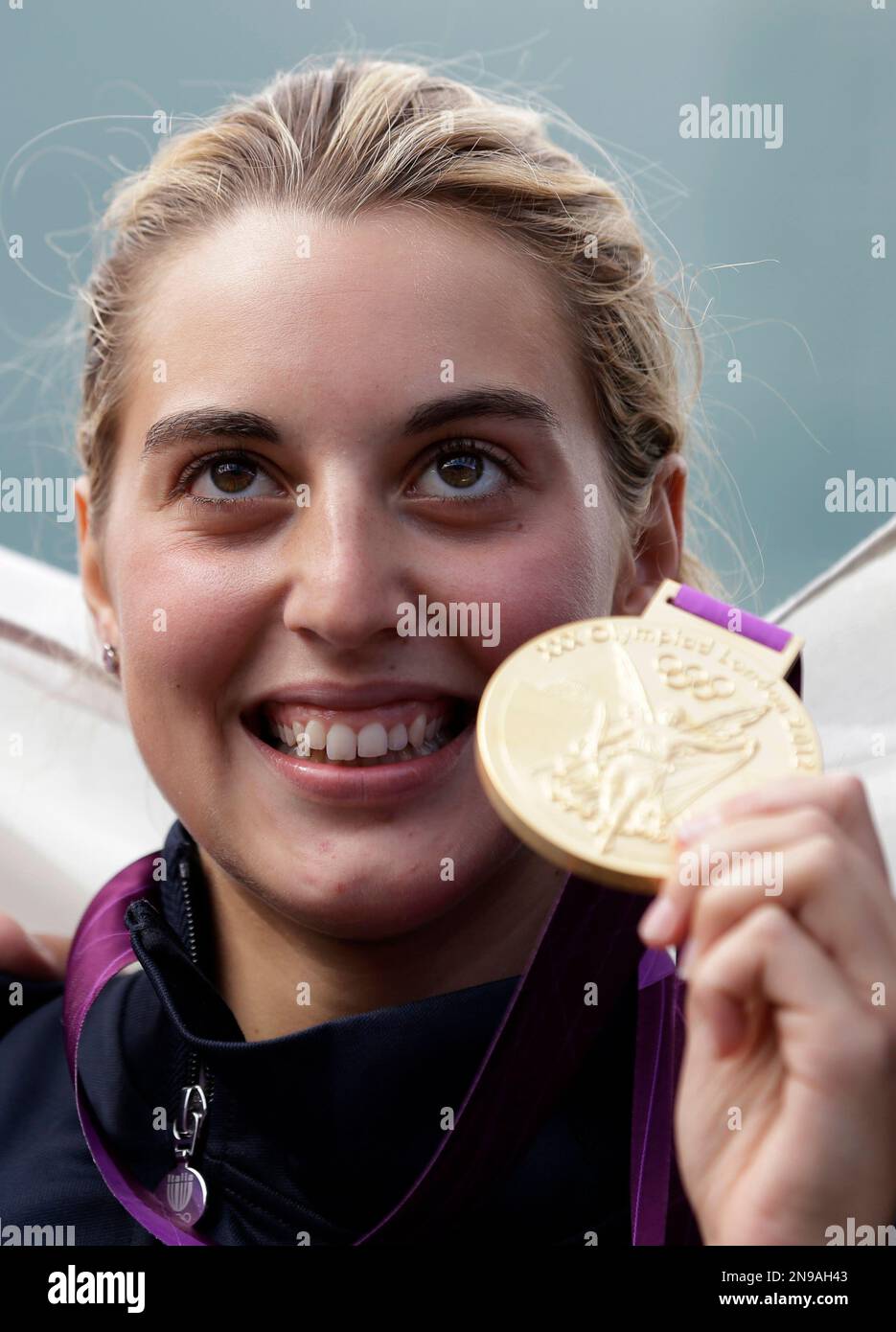 Italy's Jessica Rossi displays her gold medal, following the victory ...
