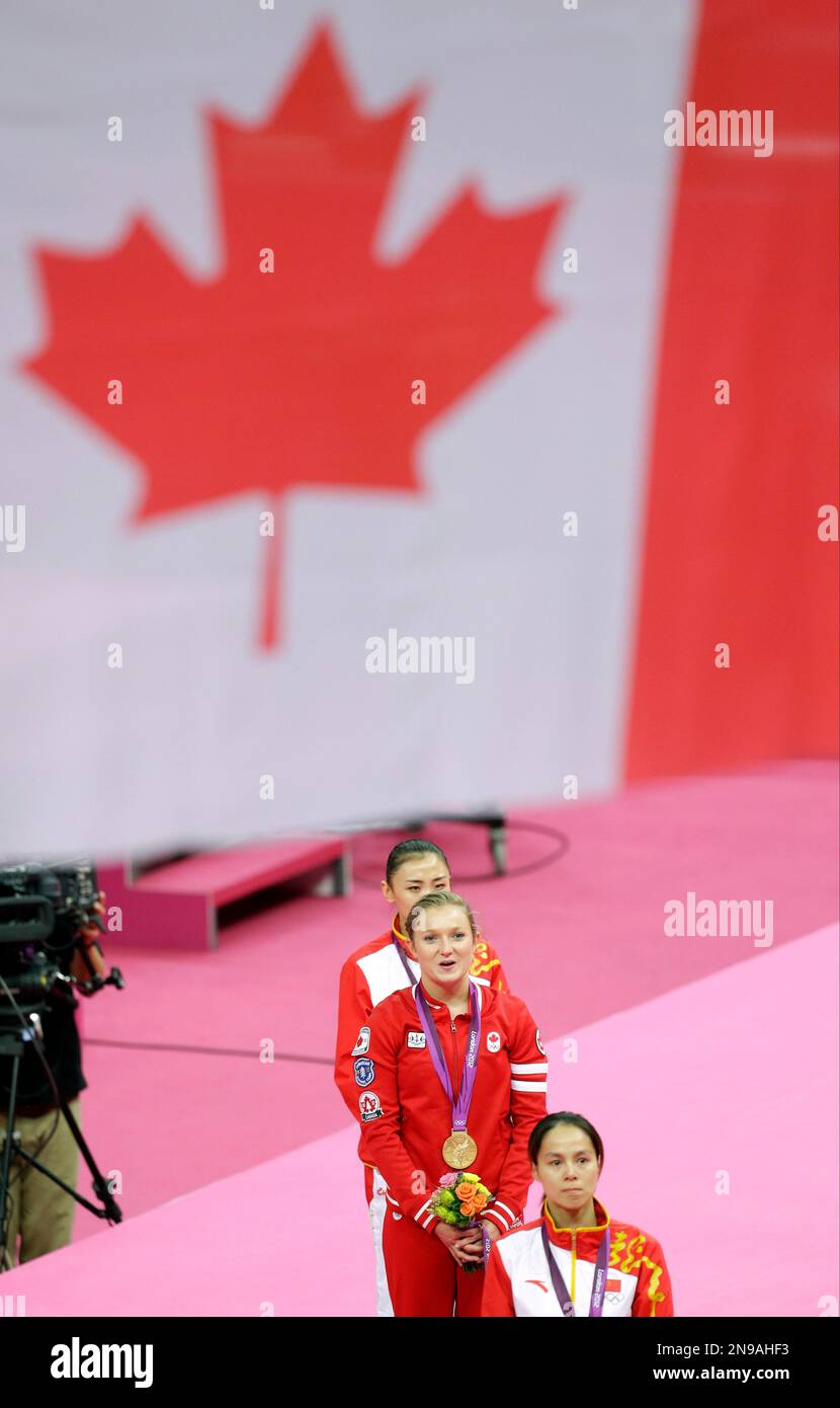 Walking bottom to top are China's silver medallist Huang Shanshan ...