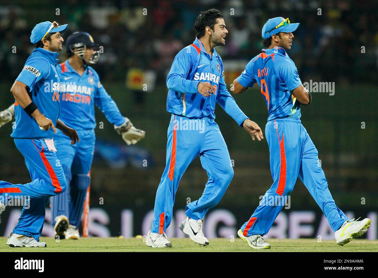 India's cricketers from left, Suresh Raina, captain Mahendra Singh ...
