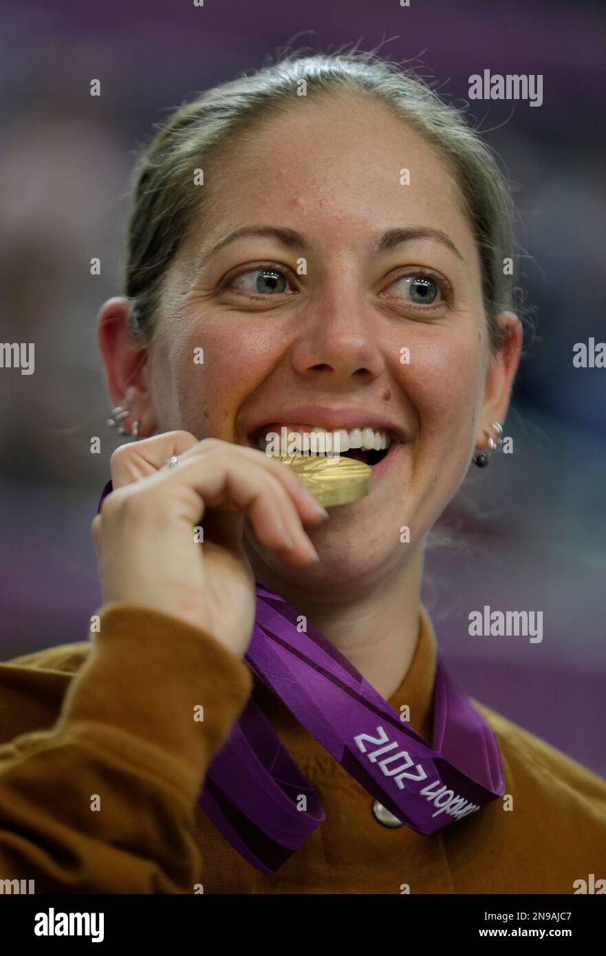 United States of America's Jamie Lynn Gray bites her gold medal ...