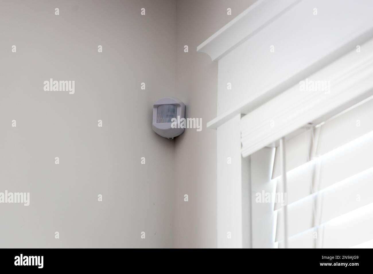 An alarm system mounted on the wall of a modern urban building Stock ...