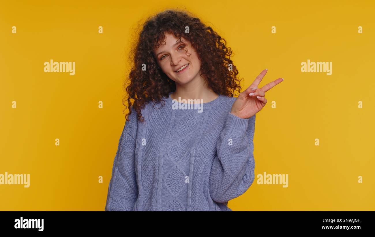 Brunette woman doing peace sign hi-res stock photography and images - Alamy