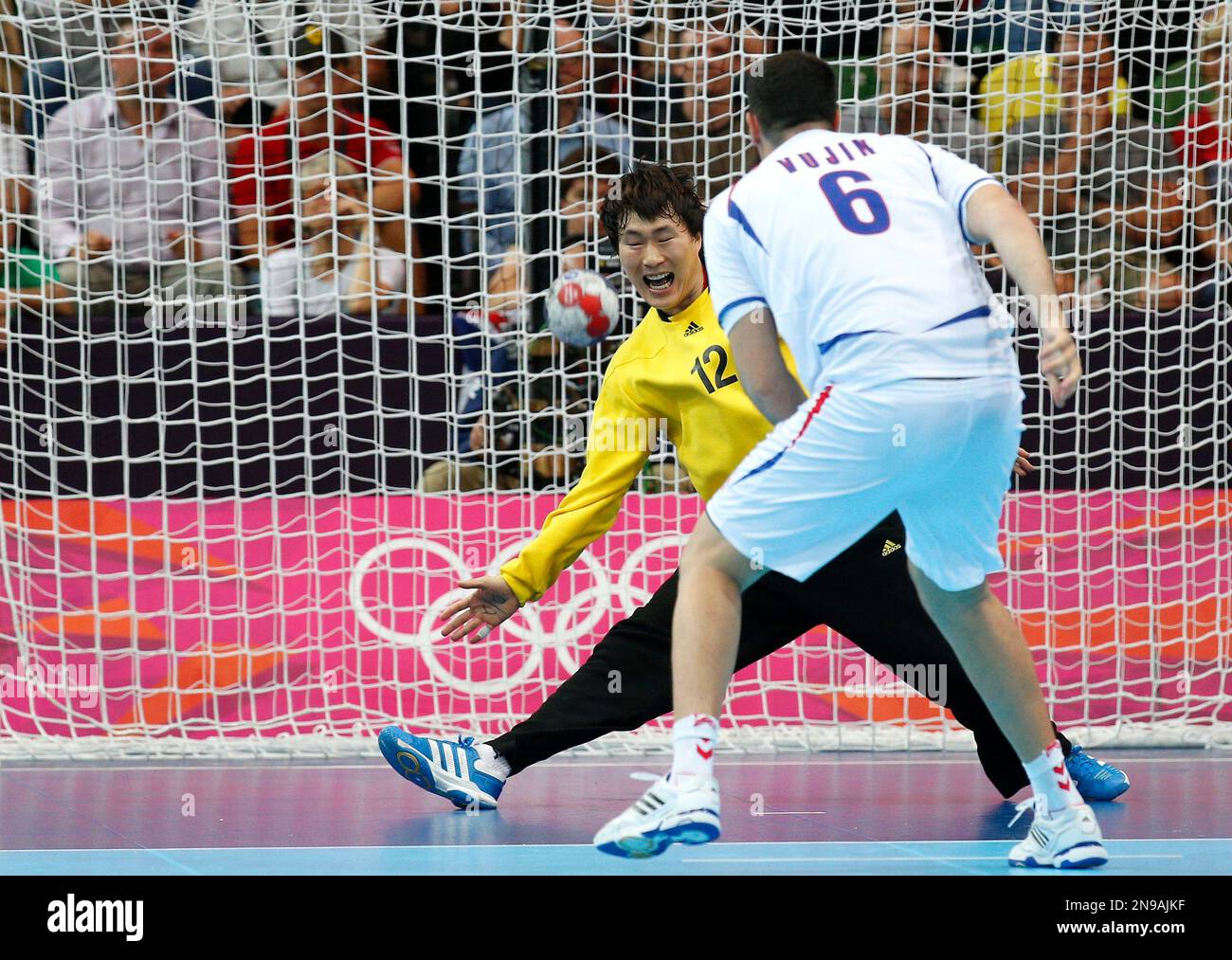 South Korea's goalkeeper Park Chan-young fails to stop a penalty kick ...
