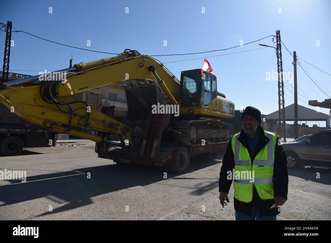 Tripoli. 11th Feb, 2023. A vehicle used for removing rubble heads to ...