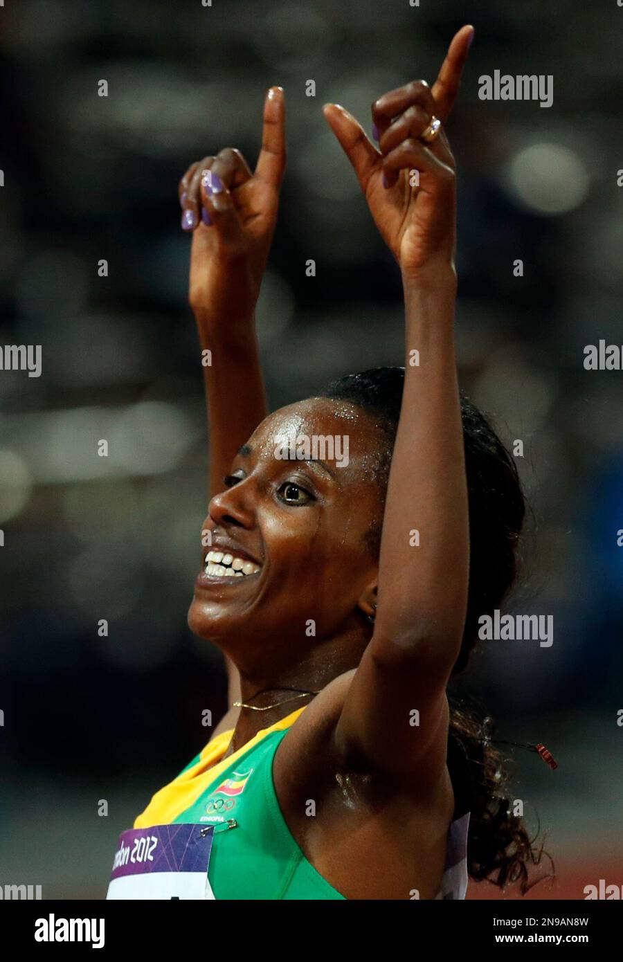 Ethiopia's Tirunesh Dibaba crosses the finish line to win the gold ...