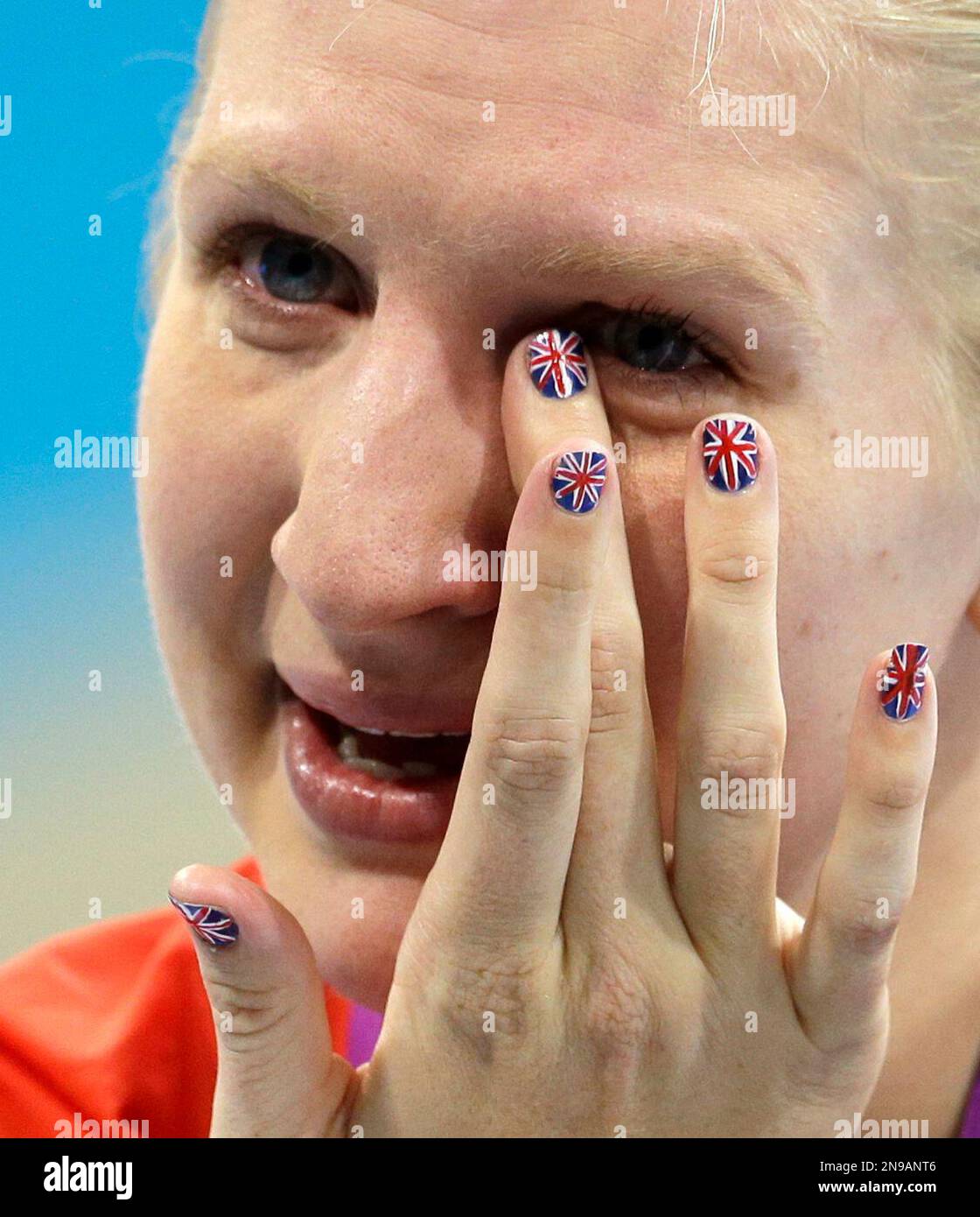 Britains Rebecca Adlington Wipes Away Her Tears On The Podium After