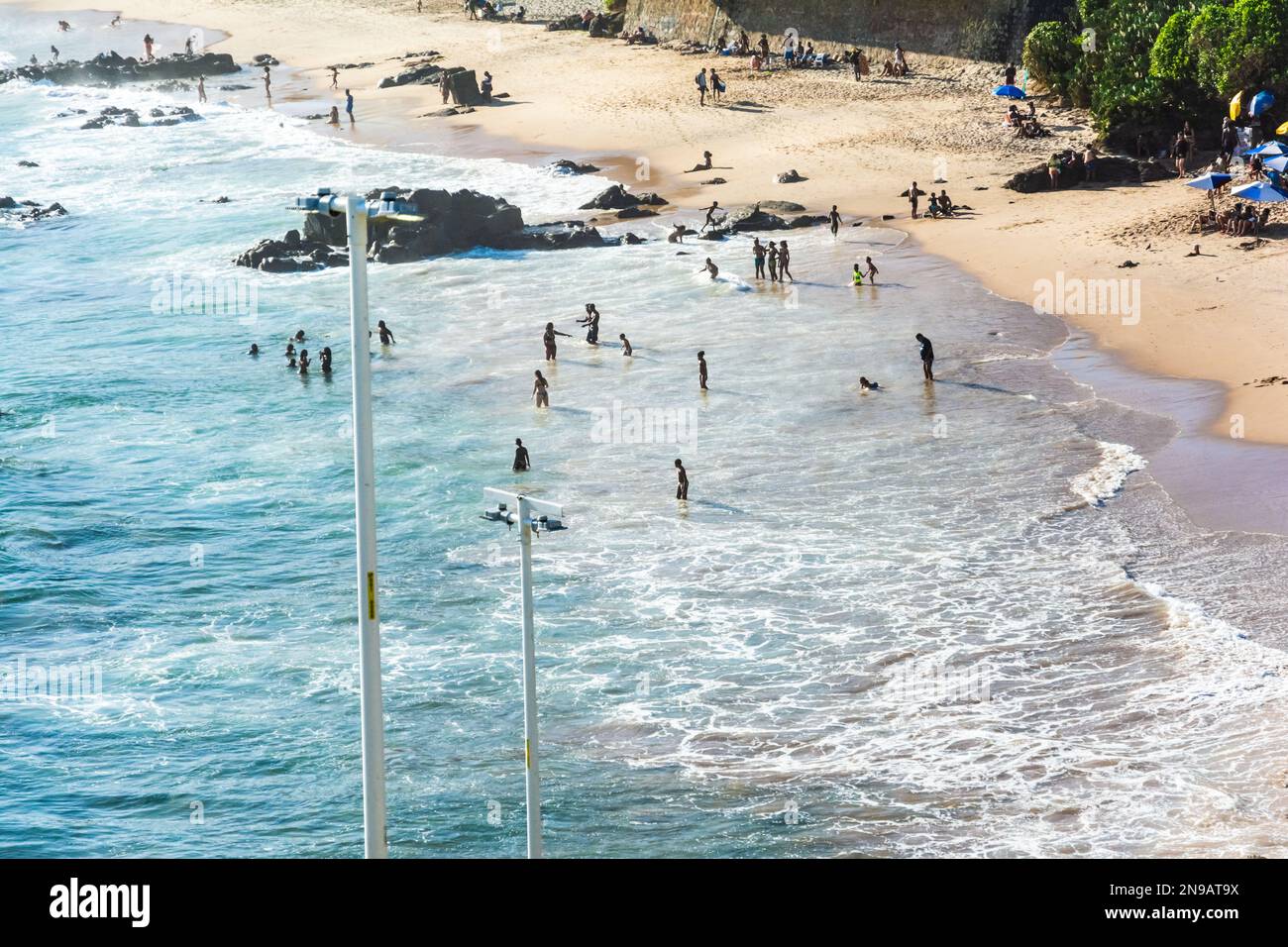 Top view of many tourists on Farol da Barra beach. Hot day. Postcard ...