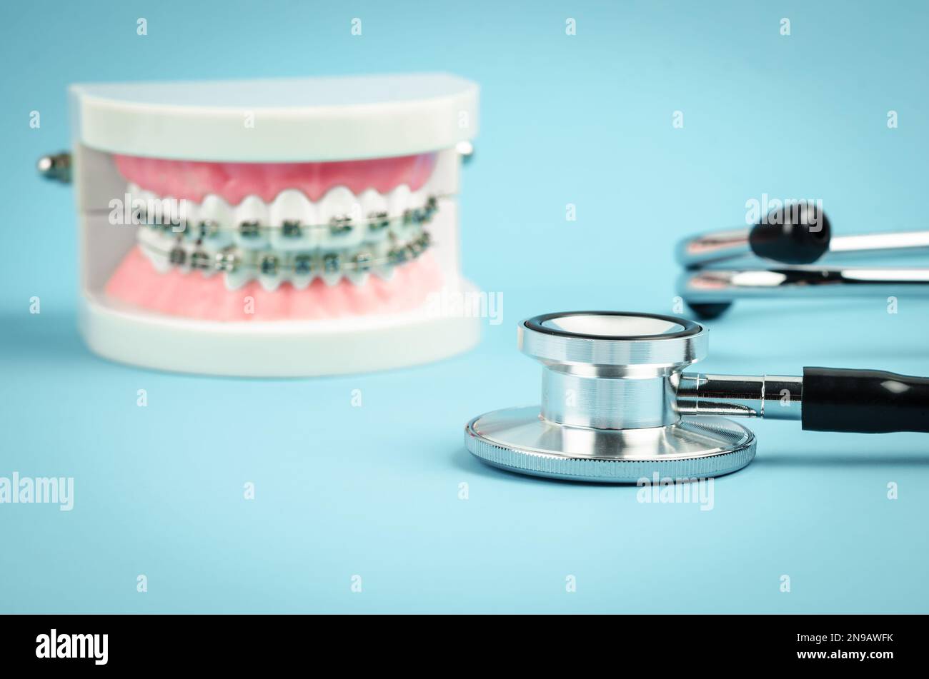 Medicine equipment stethoscope and metal wire dental braces on model ...