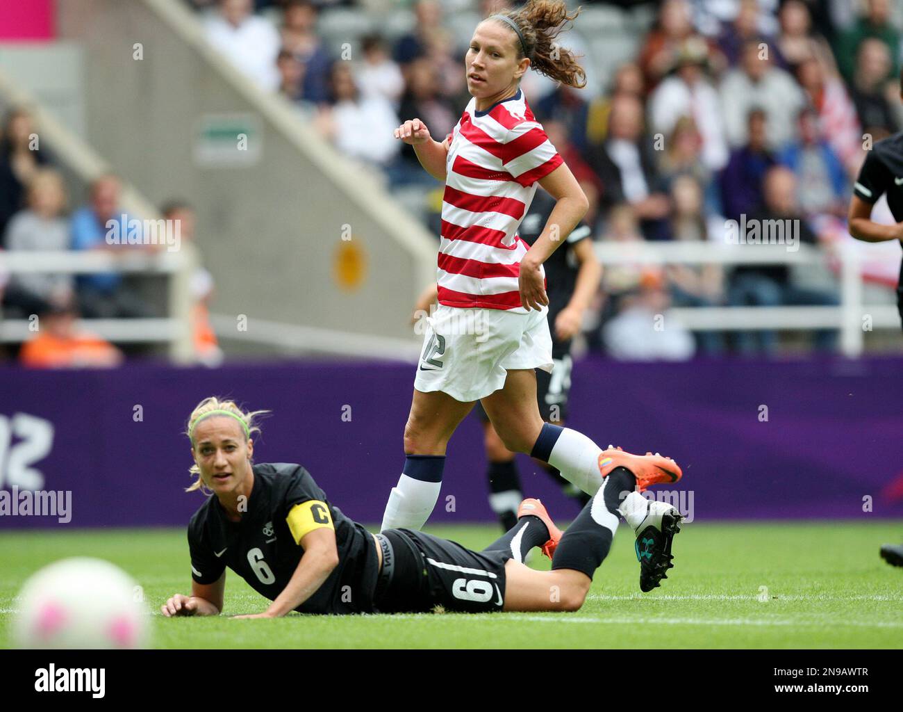 United States' Lauren Cheney, top, shoots a goal past New Zealand's ...