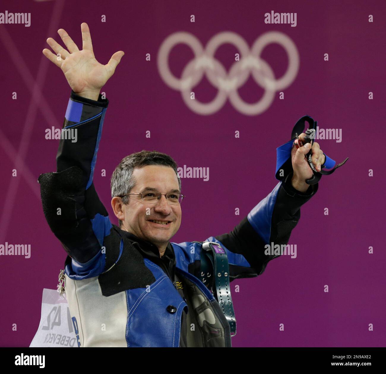 Slovenia's Rajmond Debevec celebrates winning the bronze medal in the ...