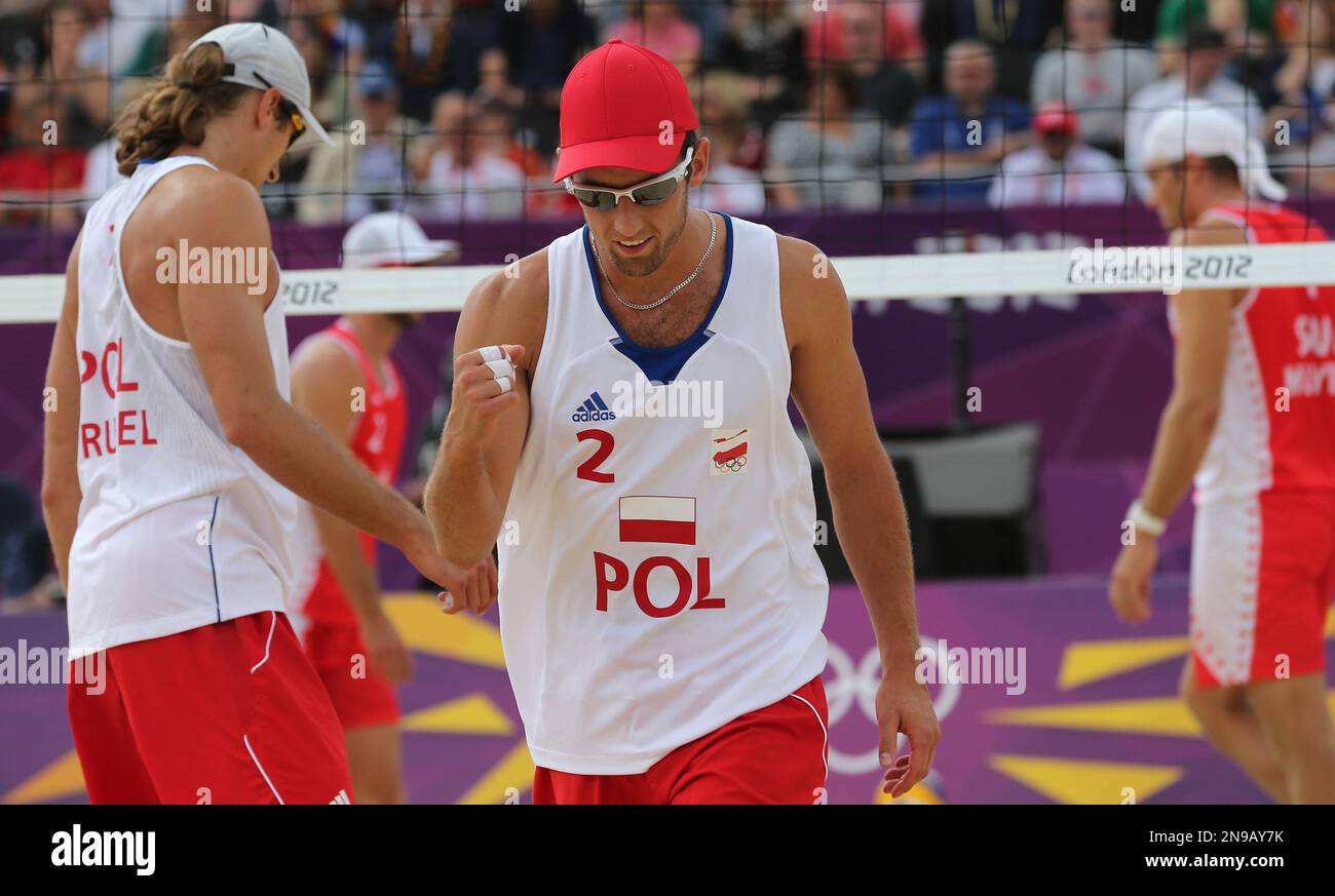 Grzegorz Fijalek, right, and Mariusz Prudel, left, from Poland react ...