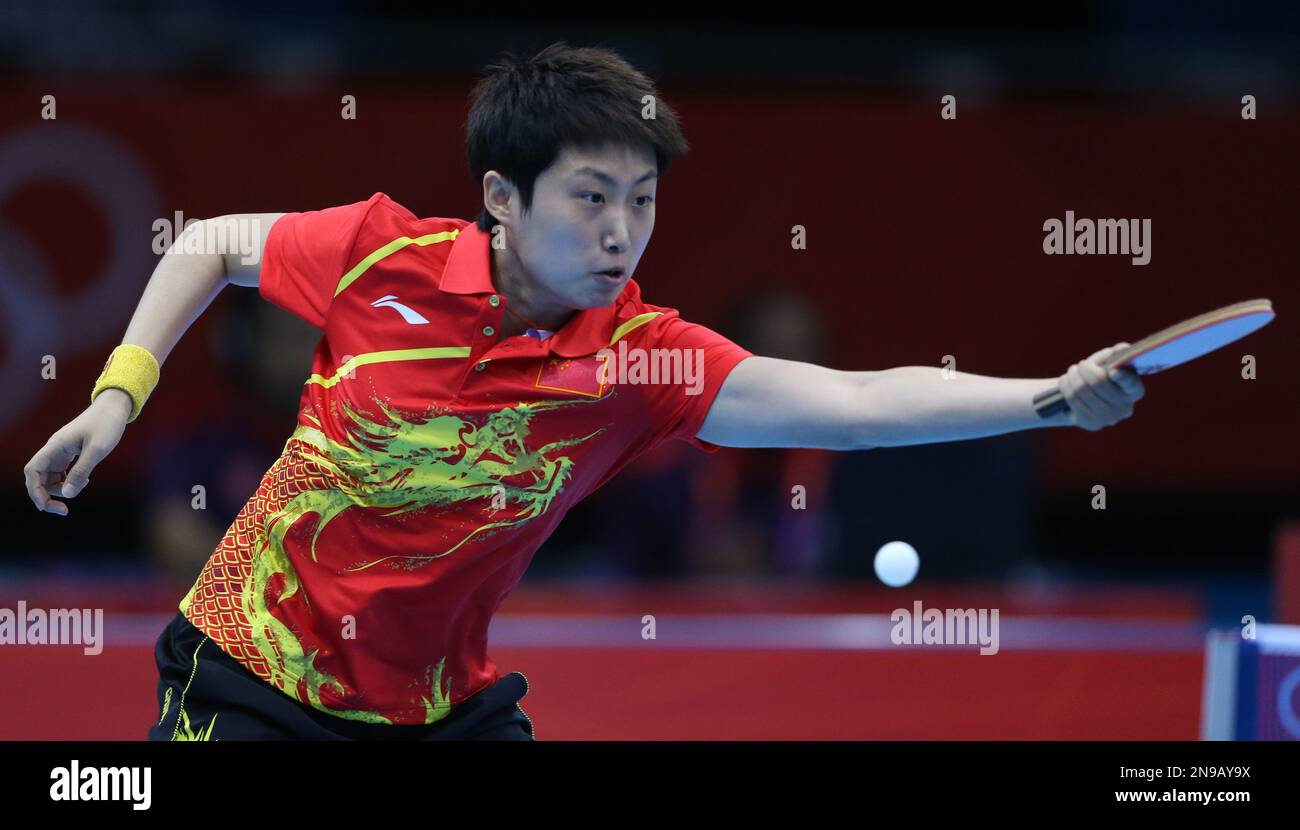 China's Guo Yue serves to Spain's Sara Ramirez during the women's team ...