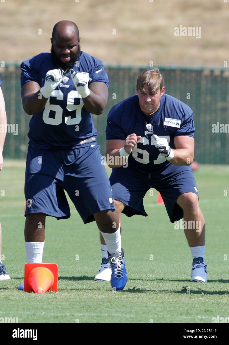 St. Louis Rams tackle Quinn Ojinnaka (69) and guard Bryan Mattison (67 ...