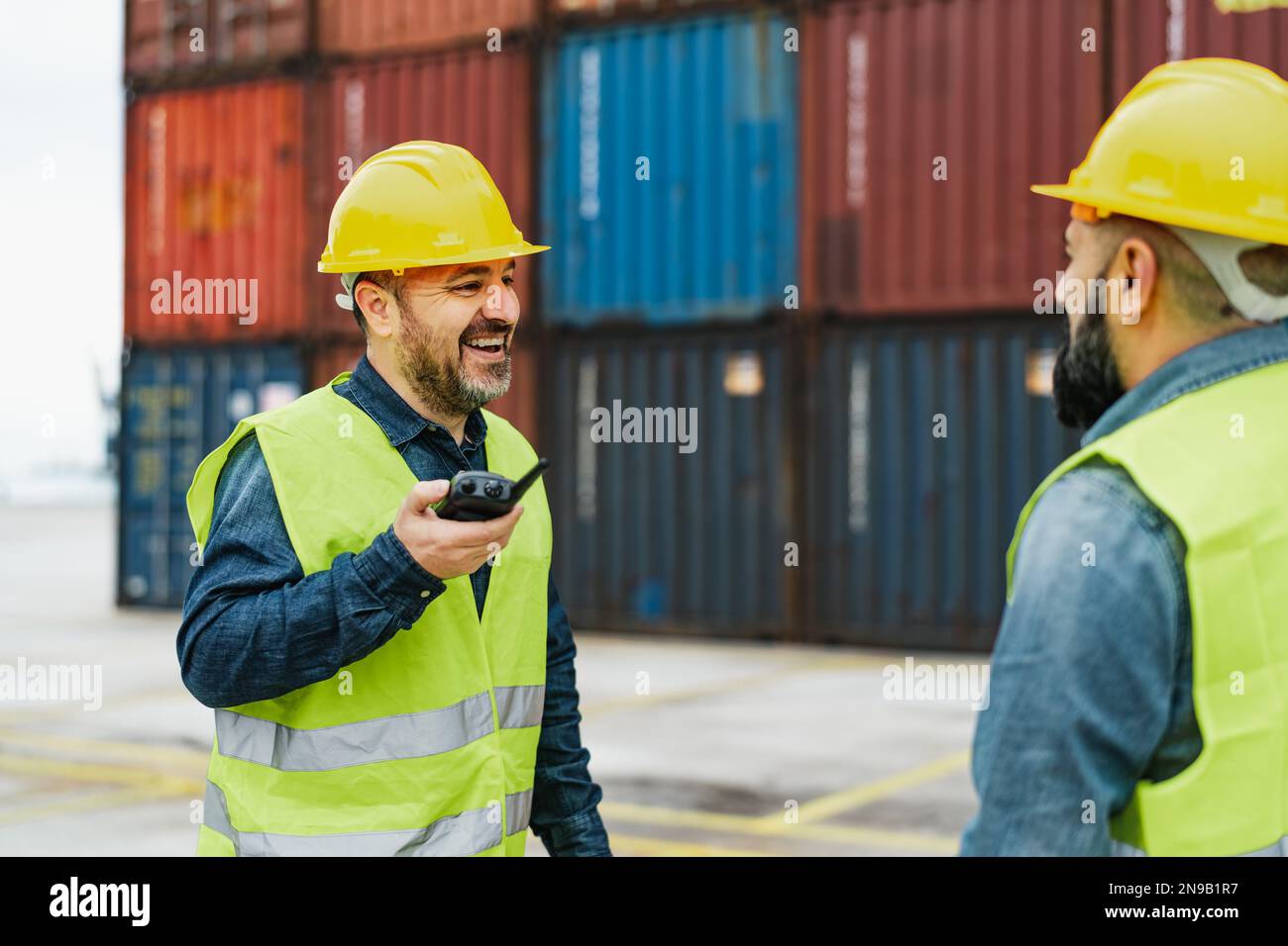Industrial engineers working in logistic terminal of container cargo ...