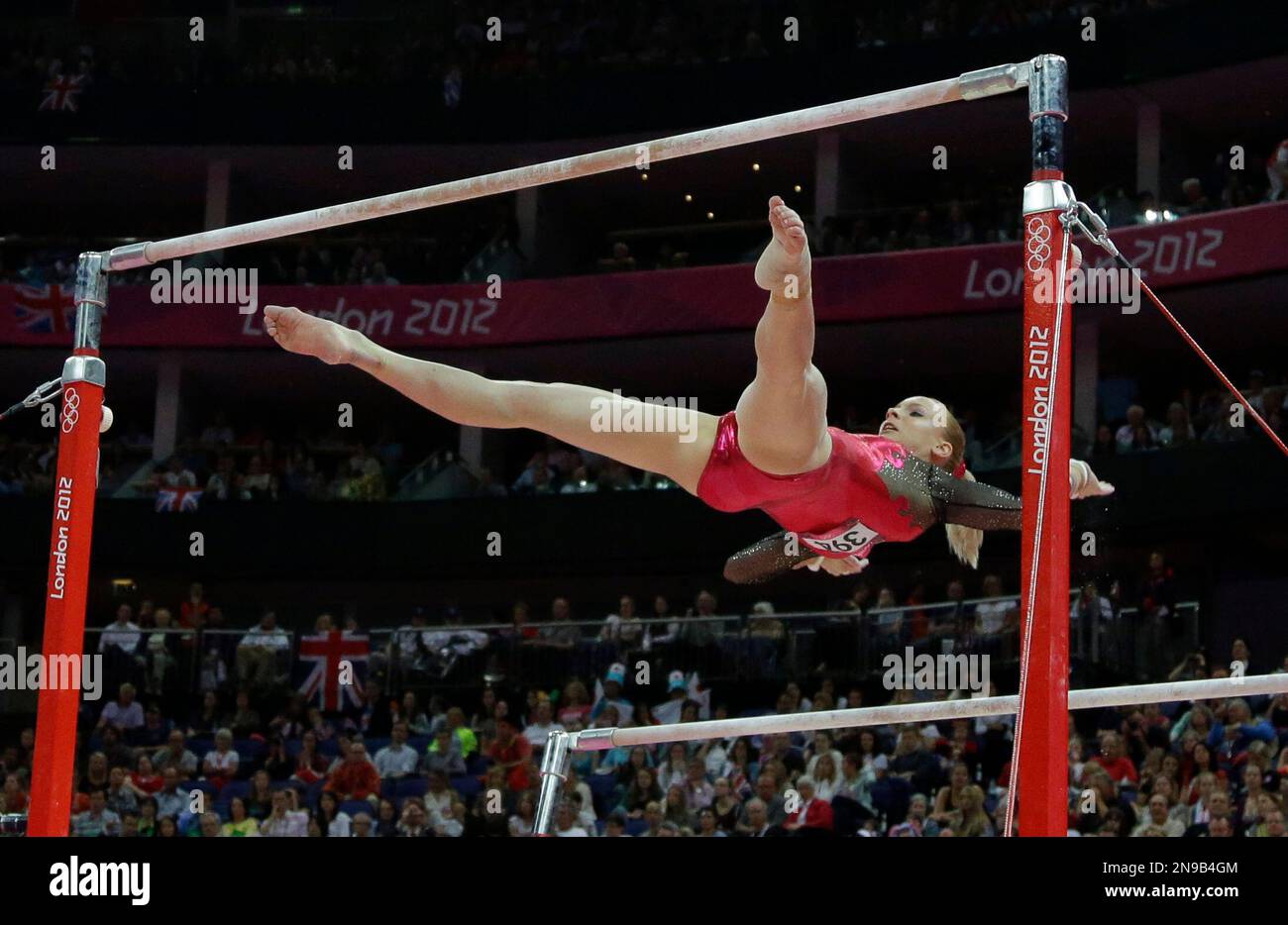 Romania's gymnast Sandra Raluca Izbasa performs on the uneven bars ...