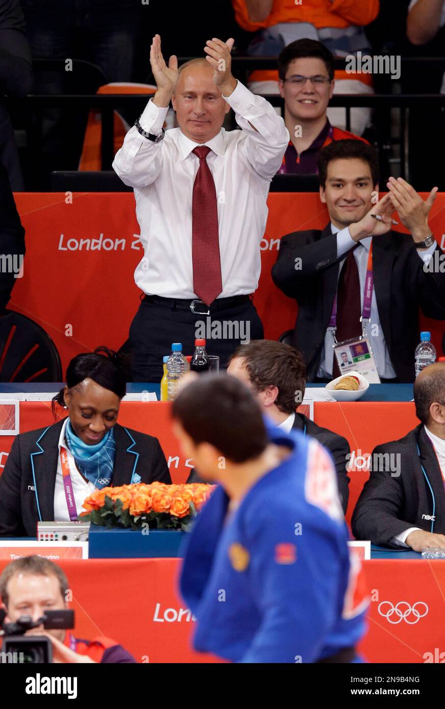 Russian President Vladimir Putin applauds Tagir Khaibulaev of Russia ...