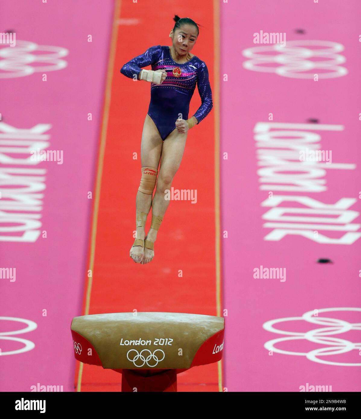 Chinese gymnast Deng Linlin performs on the vault during the Artistic ...