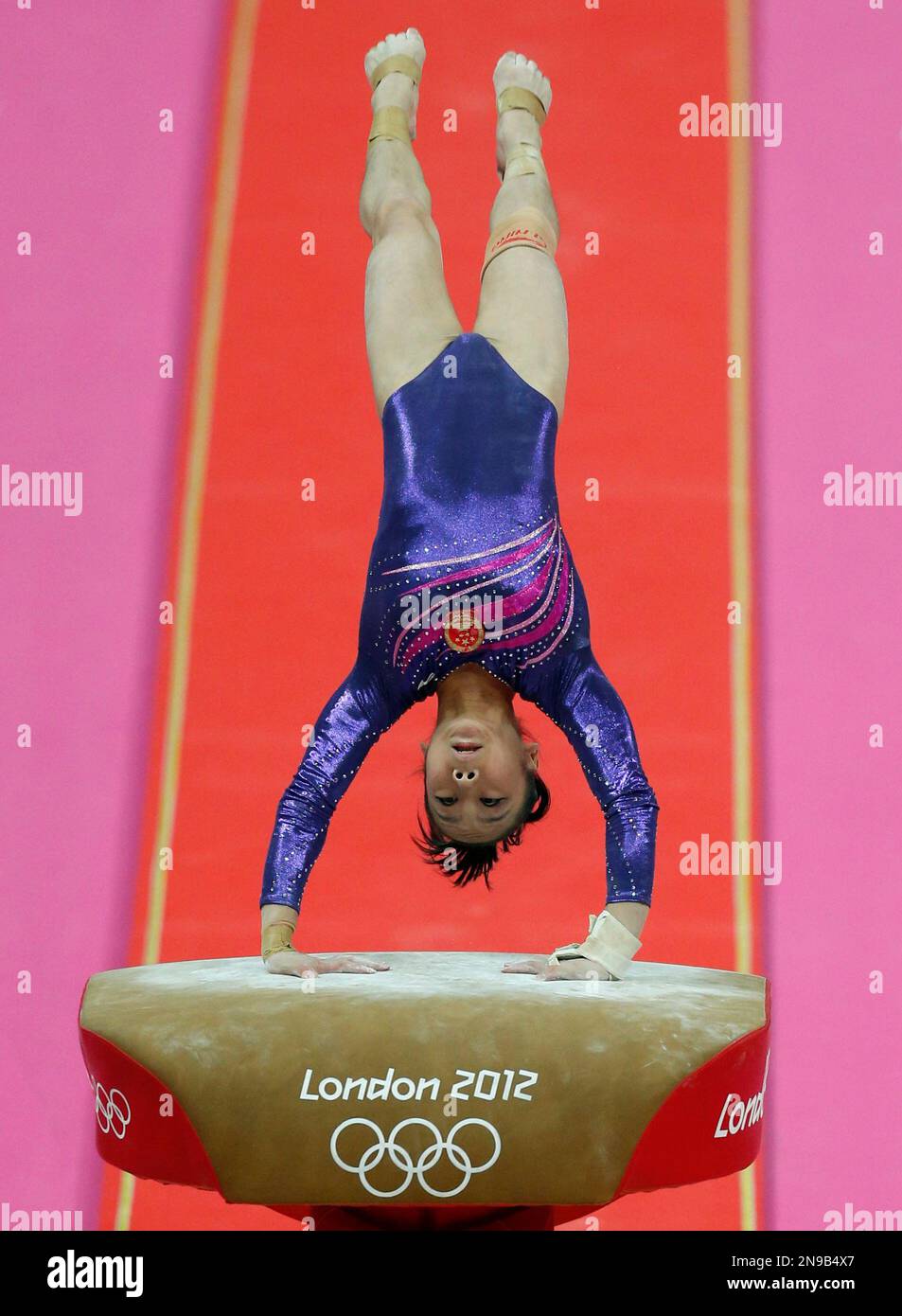 Chinese gymnast Deng Linlin performs on the vault during the Artistic ...