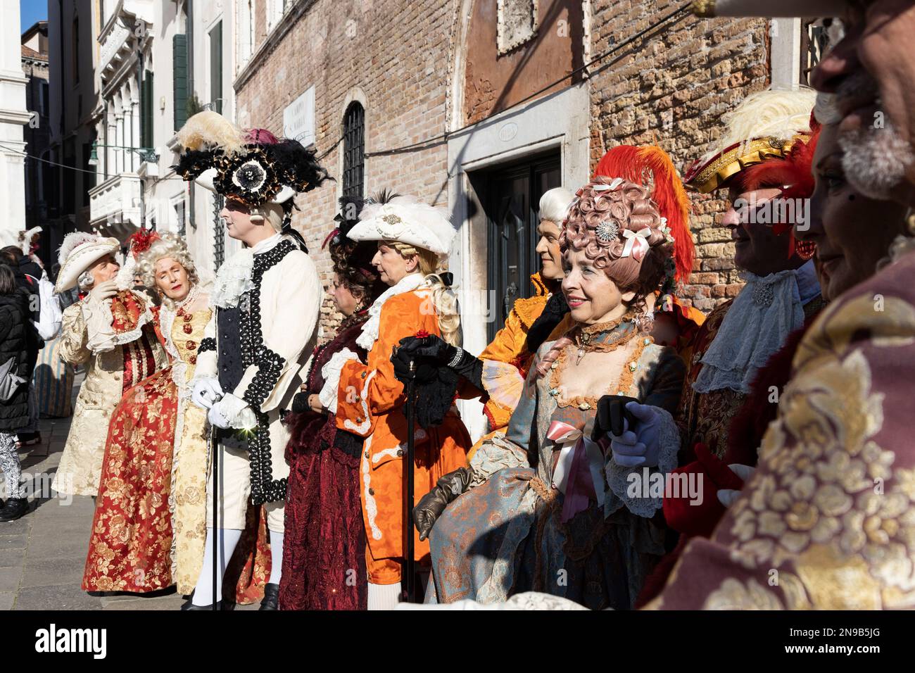 12. February 2023. Venice, Italy. Venetian revellers wear colourful ...
