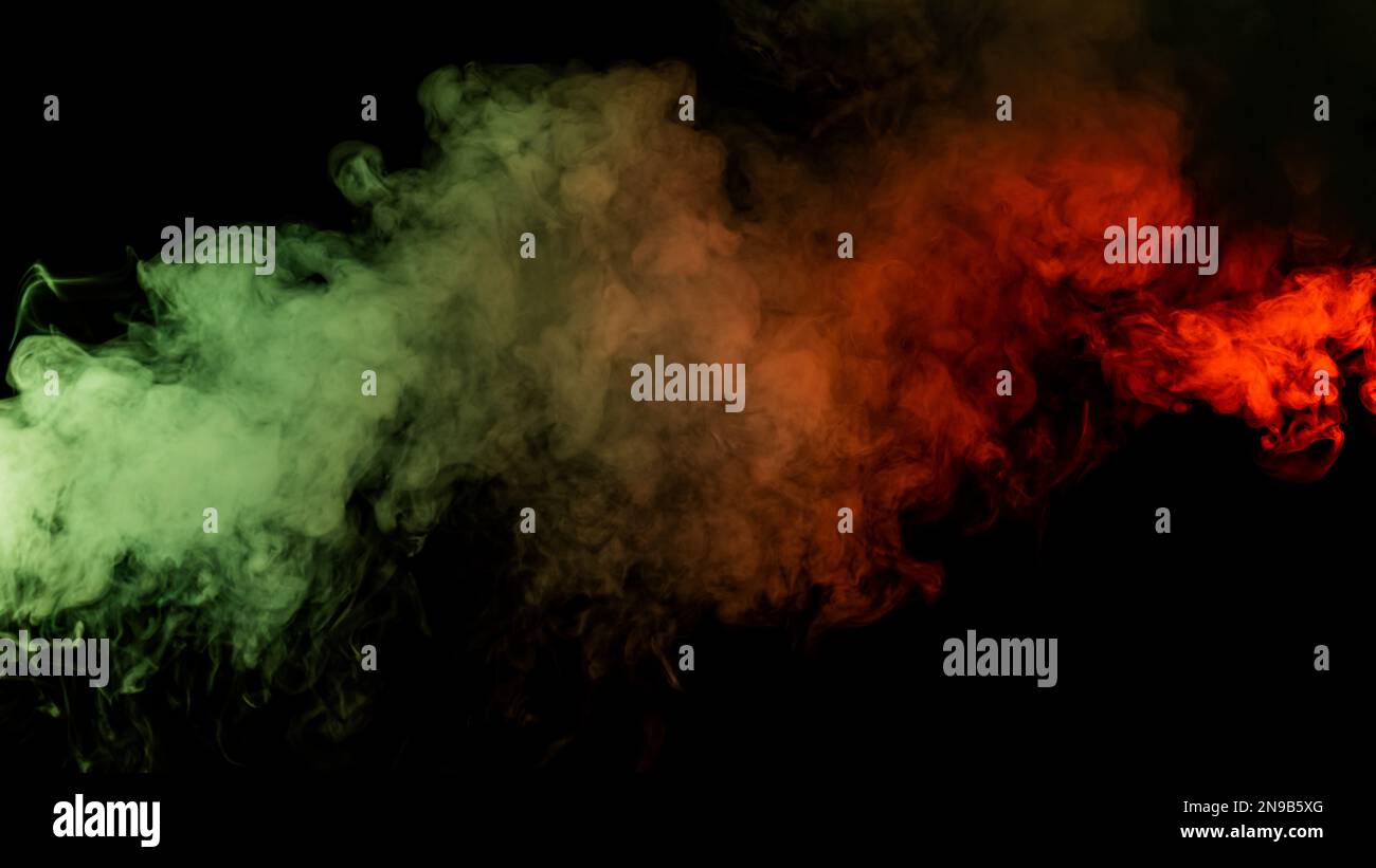 Red yellow green smoke on a black background Stock Photo - Alamy