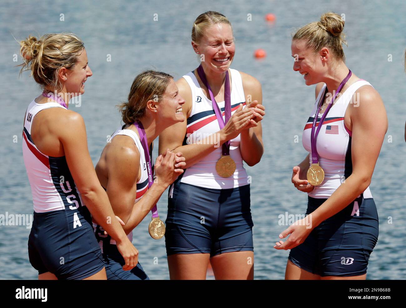 U.S. rowers of the women's eight team celebrate after winning the women ...